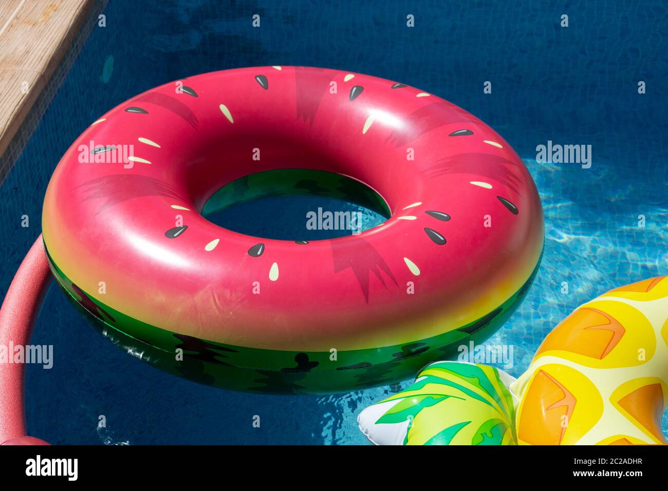 inflatable melon ring floating in swimming pool Stock Photo - Alamy