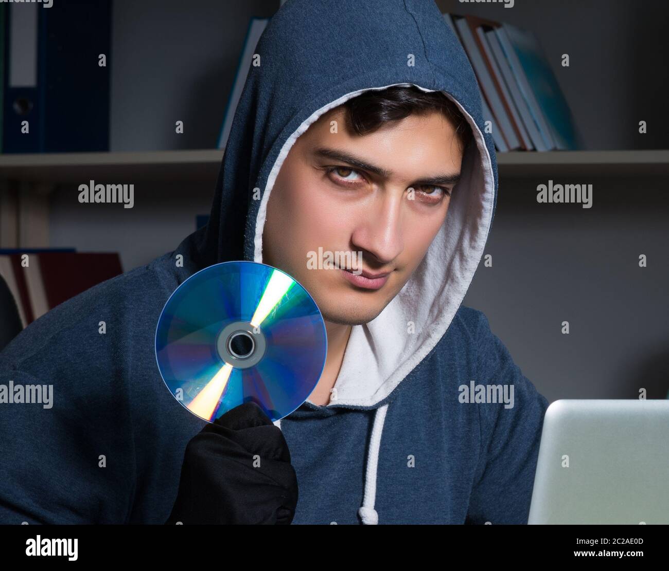 Young hacker hacking into computer at night Stock Photo - Alamy
