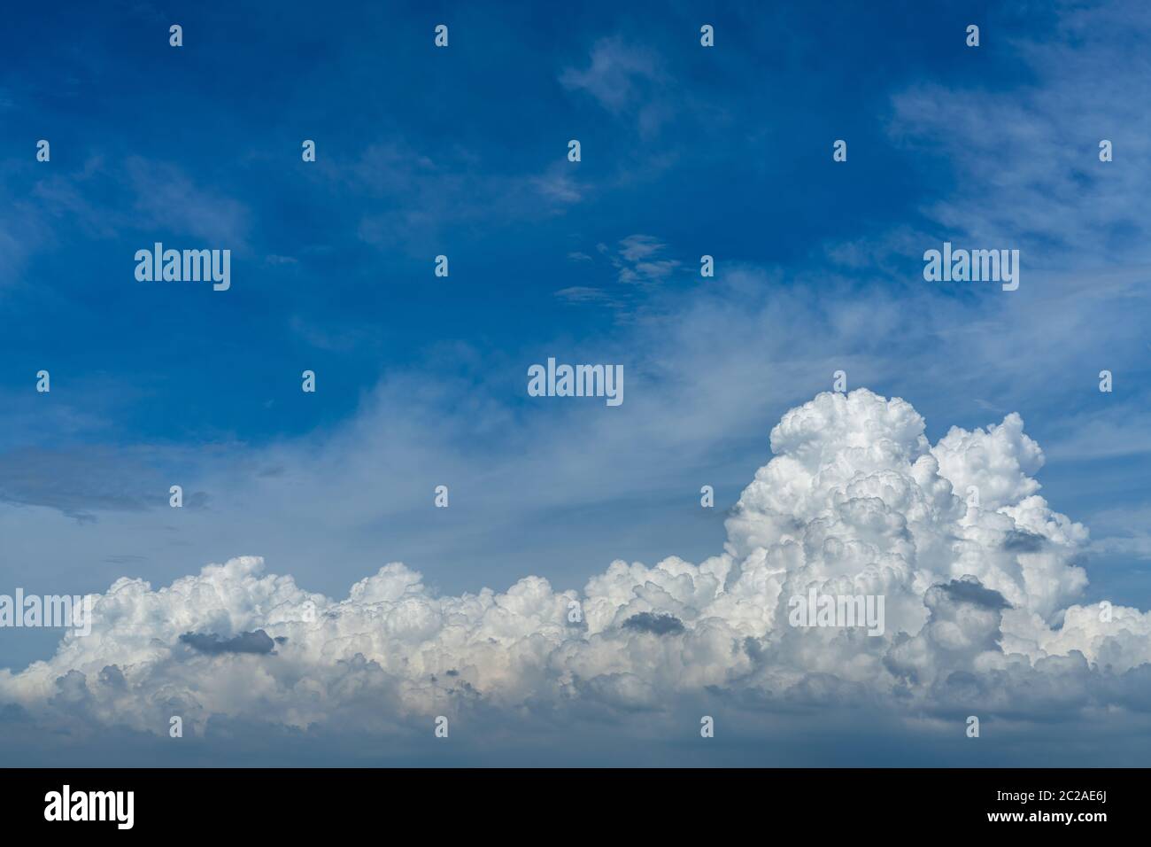 Vast white cumulus clouds with blue sky background Stock Photo - Alamy