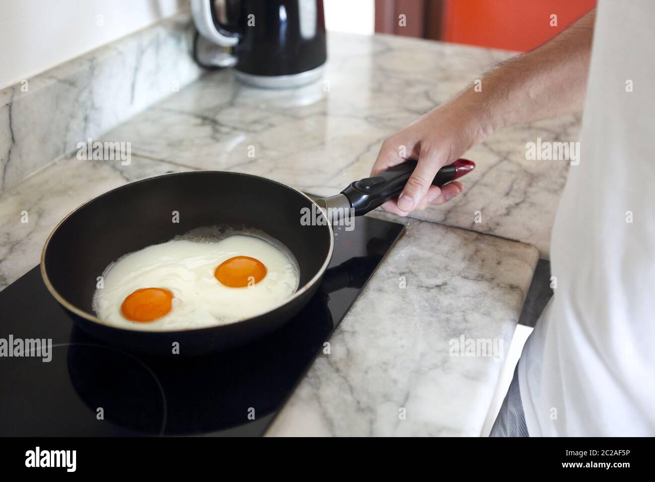 Person making scrambled eggs hi-res stock photography and images - Alamy