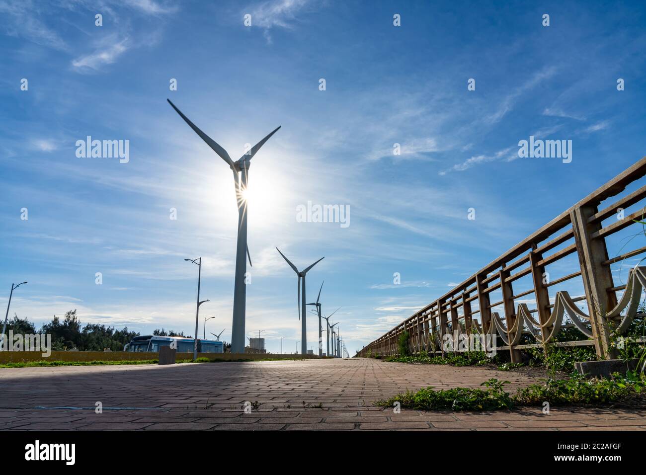 Gaomei Wetlands Area wind turbines in sunset time, a flat land which ...