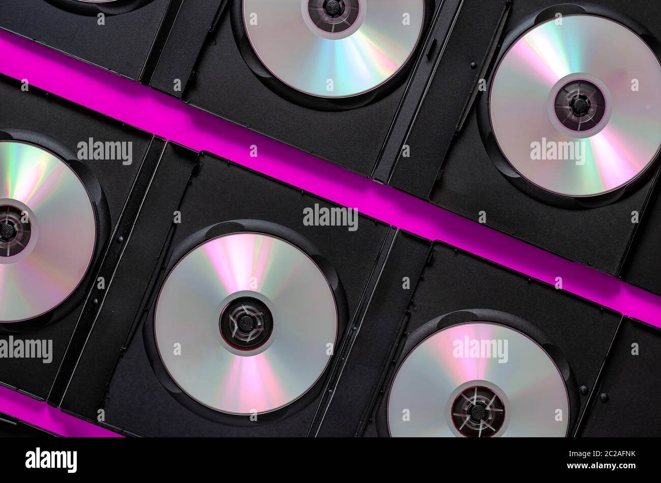 The evolution of digital media. SD Blu-ray discs in open black boxes on ...