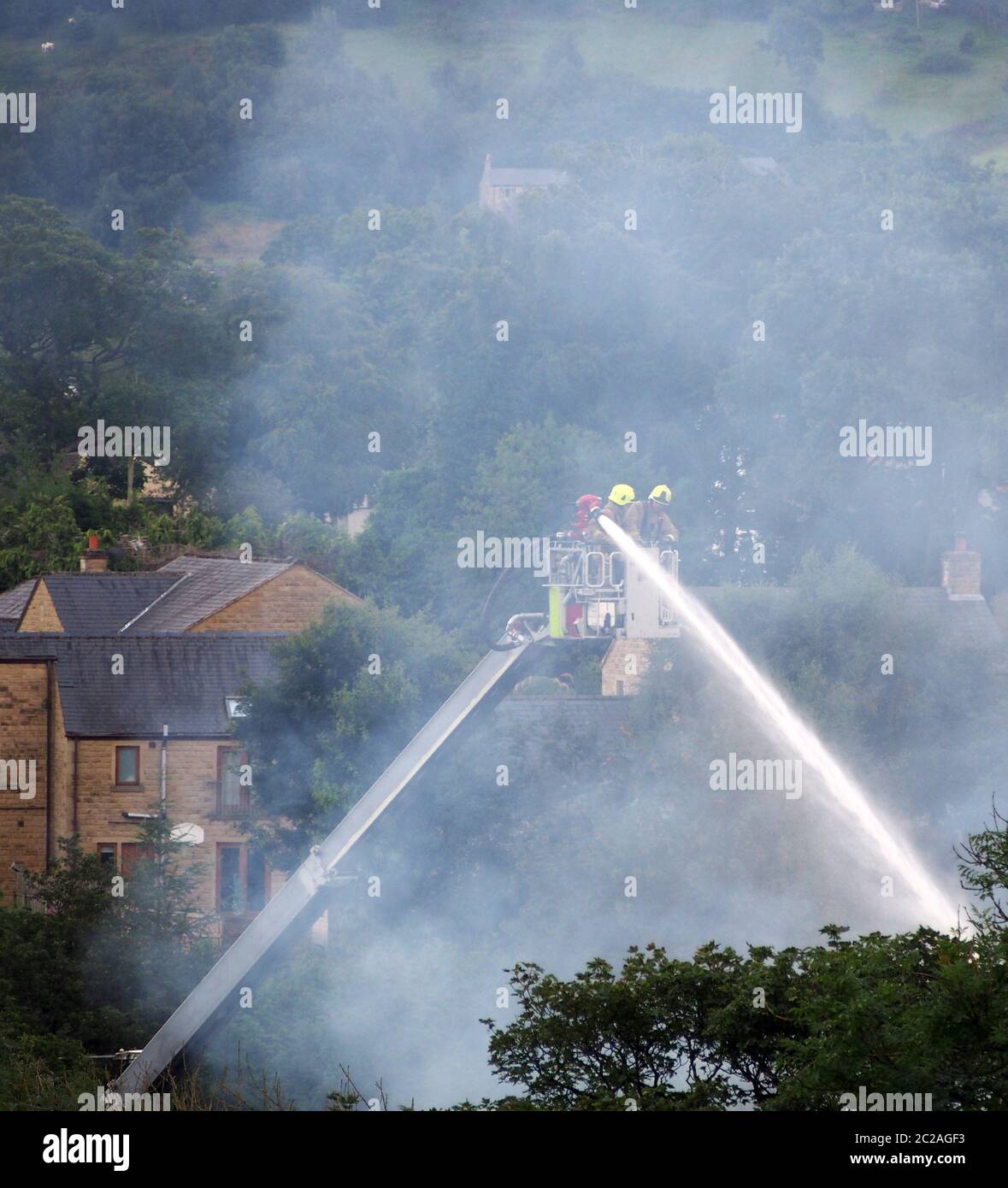 firemen on an elevated platform putting out the fire at the former ...