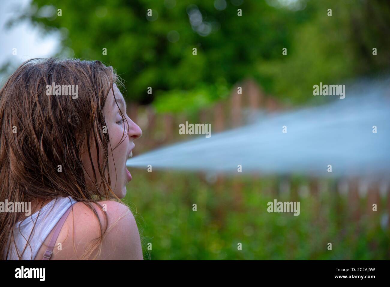 Spitting faces hi-res stock photography and images - Alamy