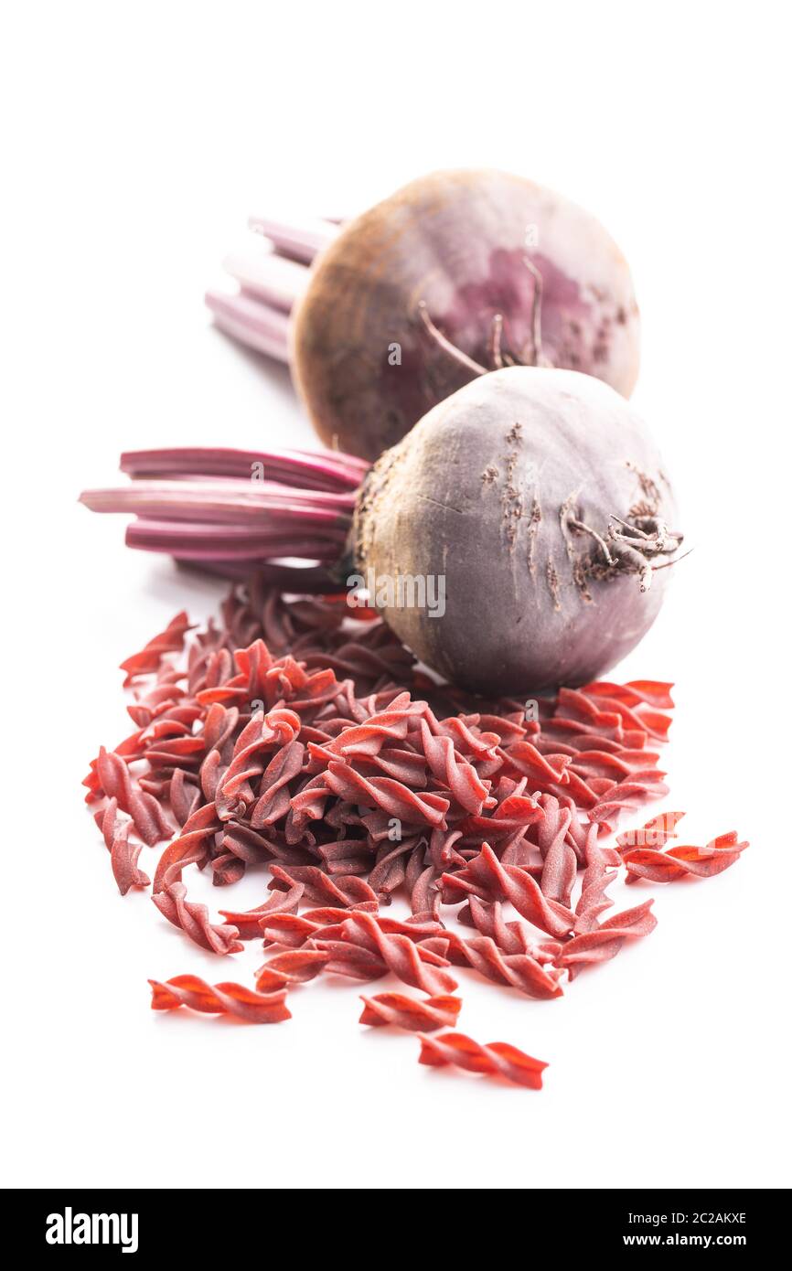 Tasty raw beetroot and beetroot pasta isolated on white background ...