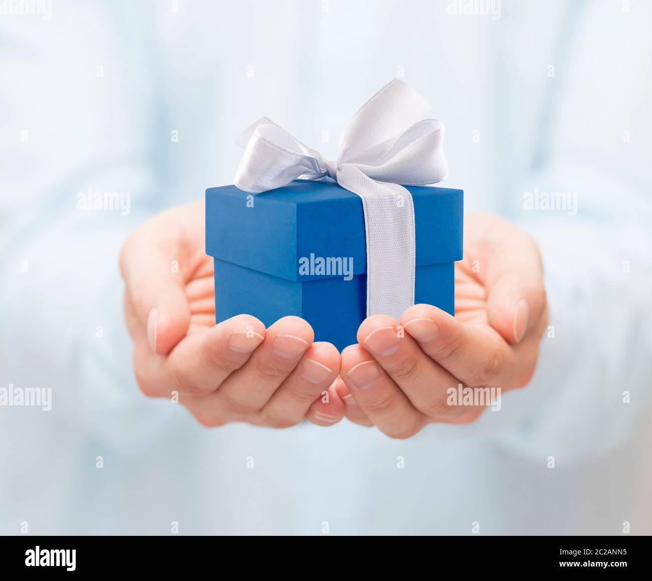 Blue box hand hi-res stock photography and images - Alamy