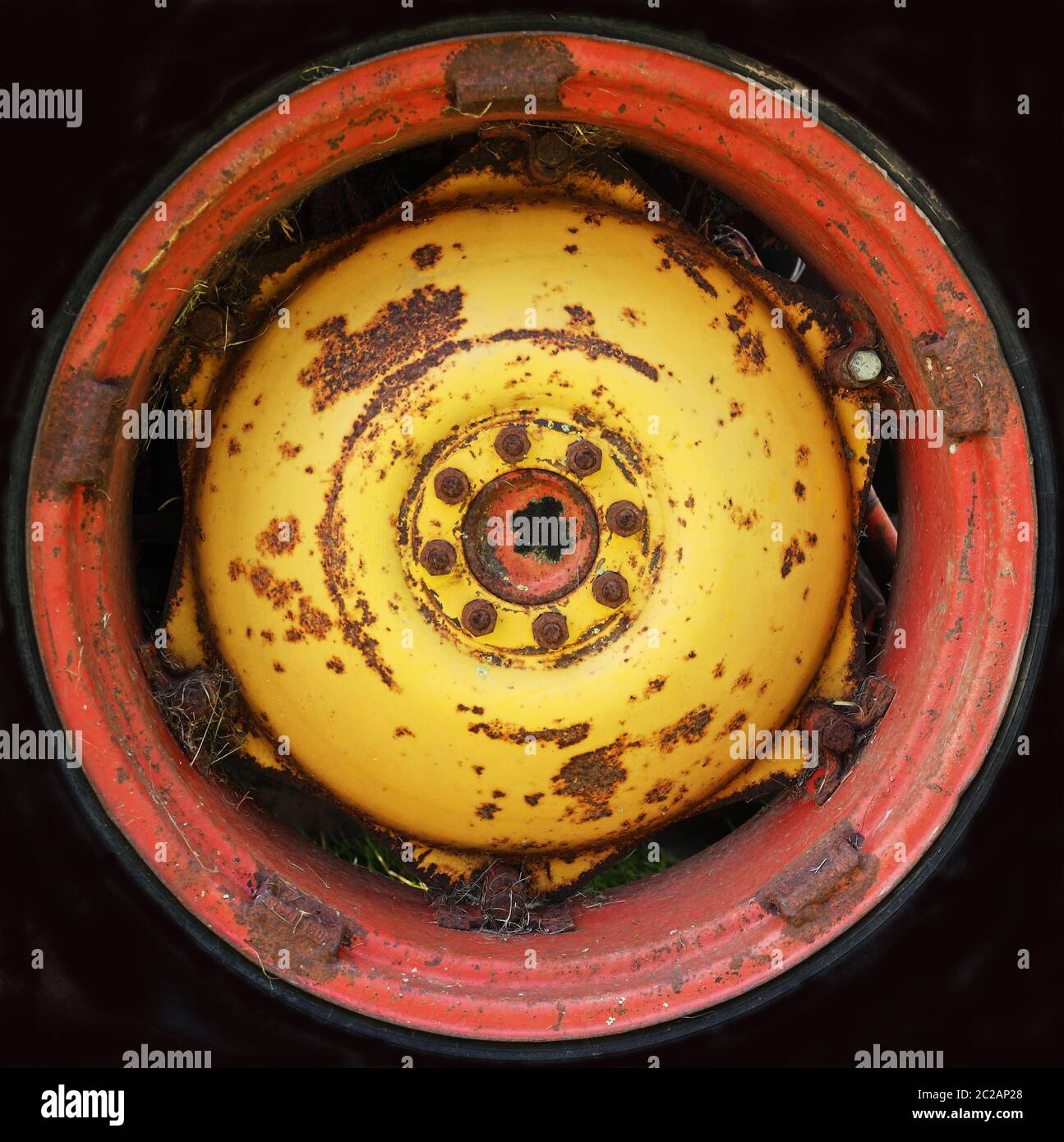 Tractor wheel. Close up abstract of old rusty, flaking tractor wheel ...