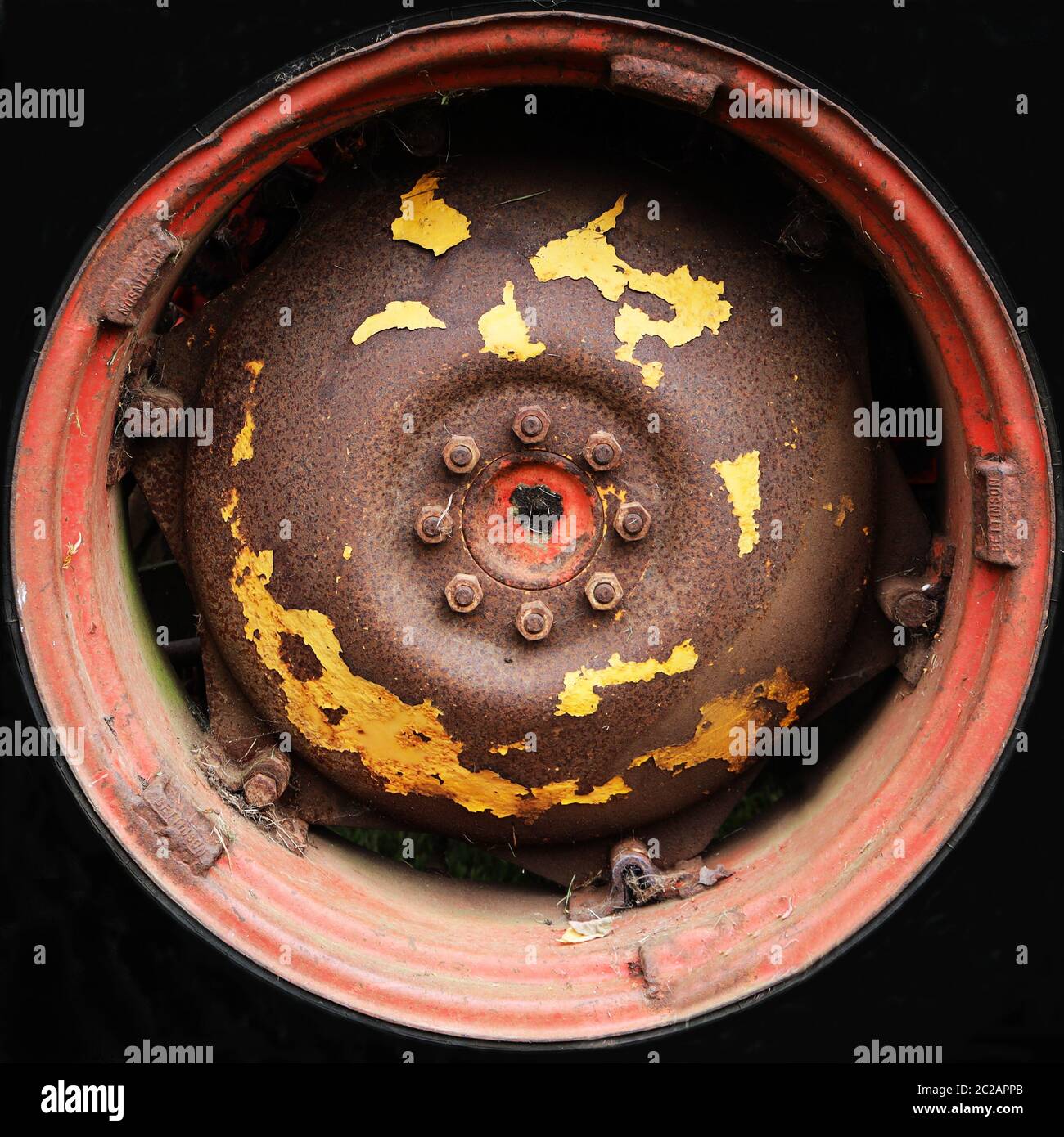 Tractor wheel. Close up abstract of old rusty, flaking tractor wheel ...