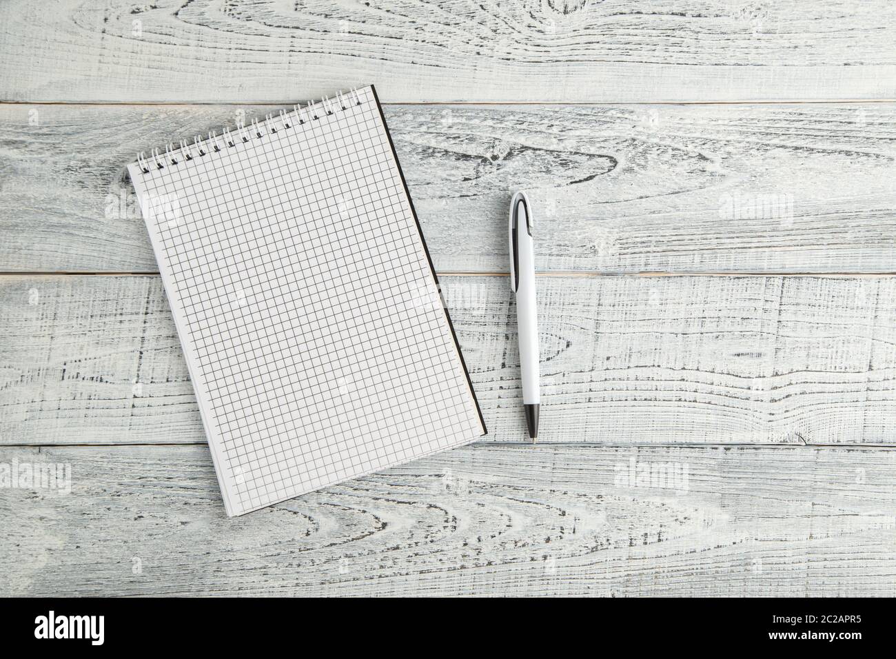 white paper Notepad and white pen on vintage shabby white wooden ...