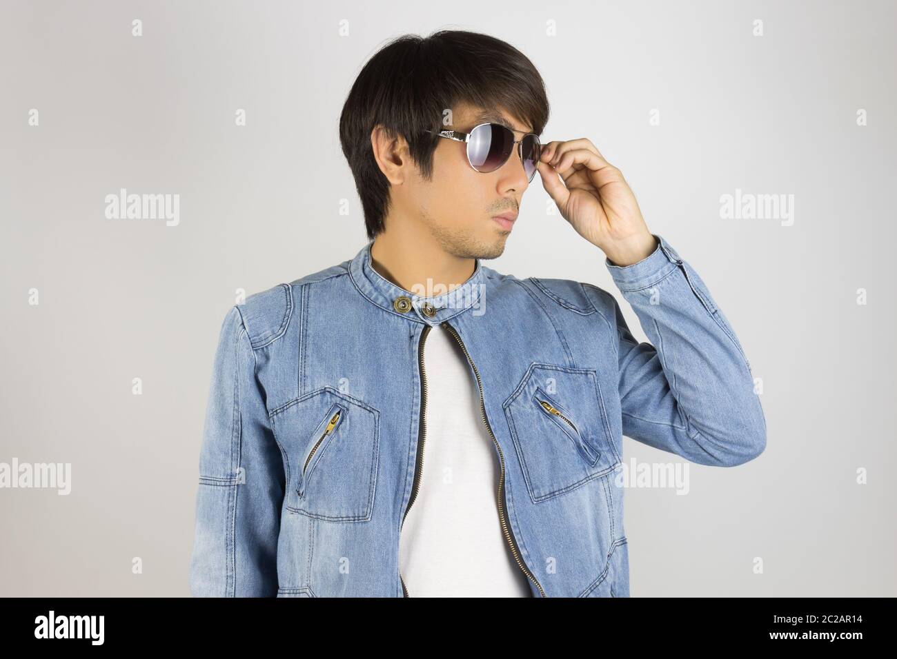 Young Asian Man in Jeans Jacket or Denim Jacket Wear and Touch ...