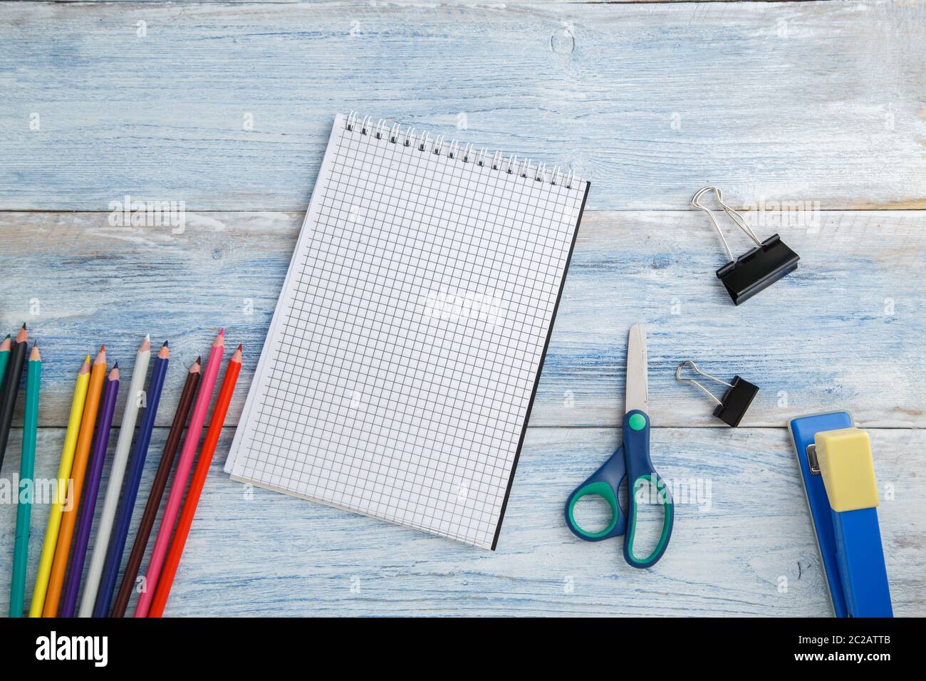 school children's concept. colored pencils or crayons,scissors,stapler ...