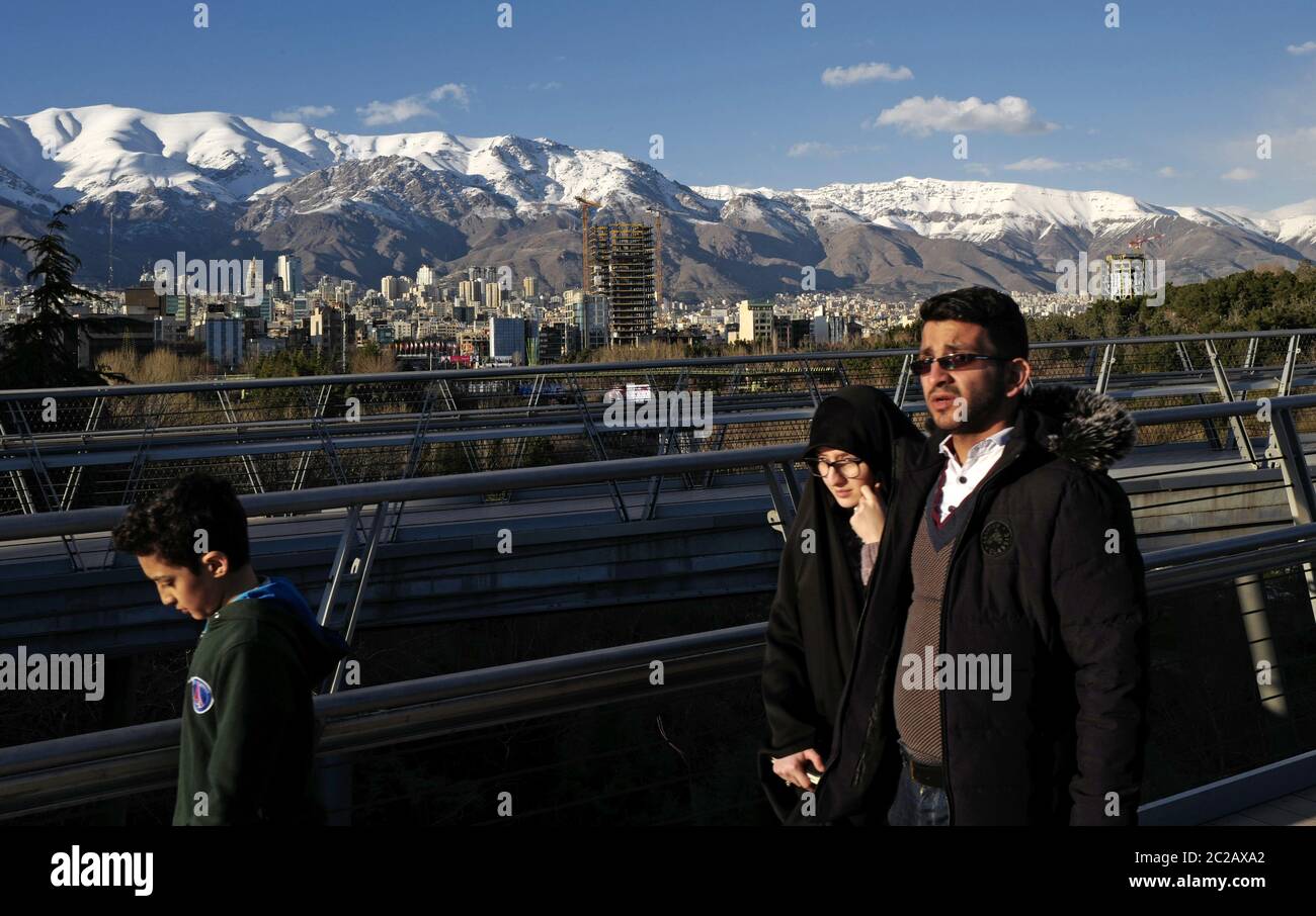 Iranian people crossing the modern Tabiat pedestrian bridge, to ...