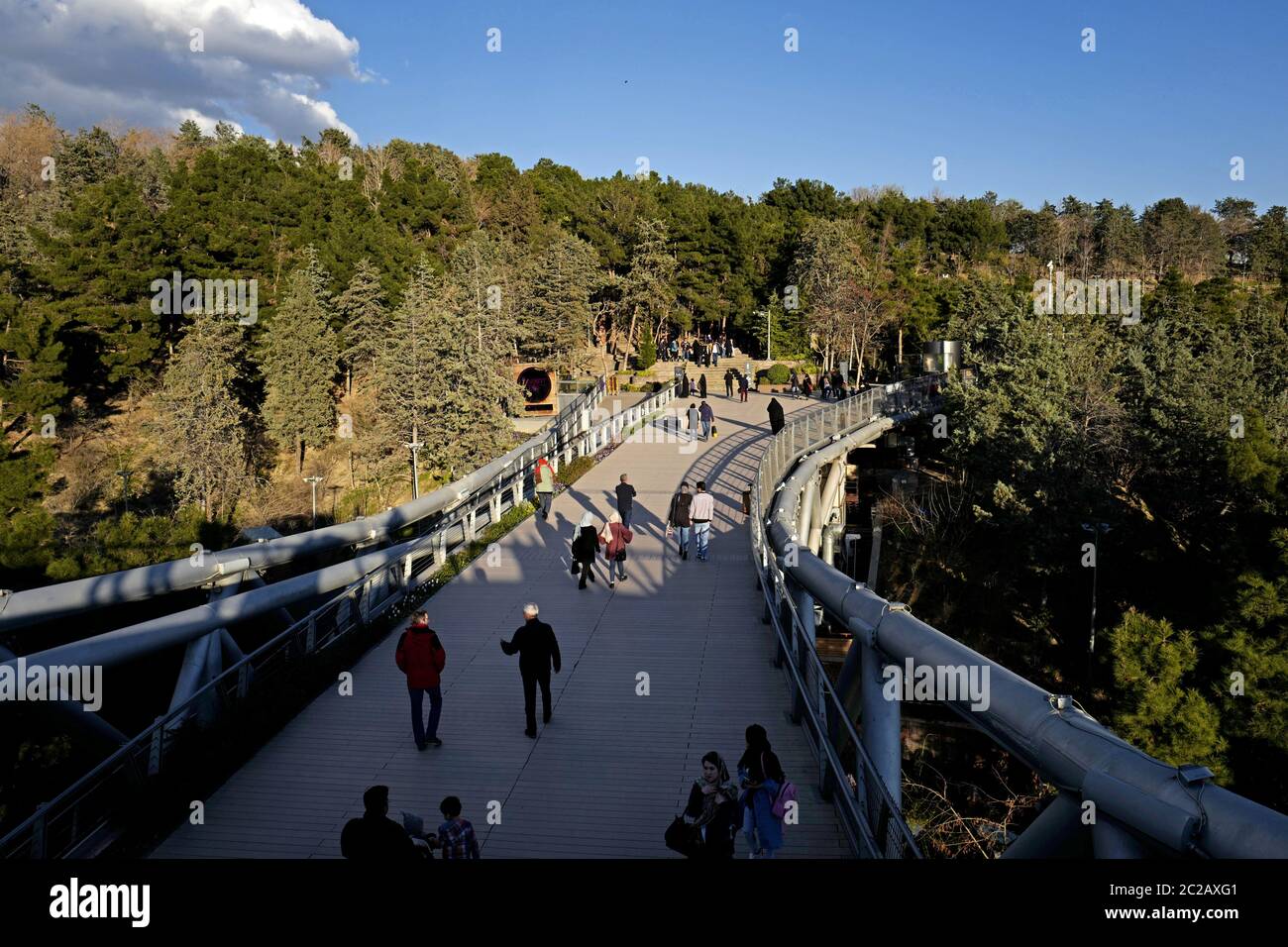 Iranian people crossing the modern Tabiat pedestrian bridge, to ...