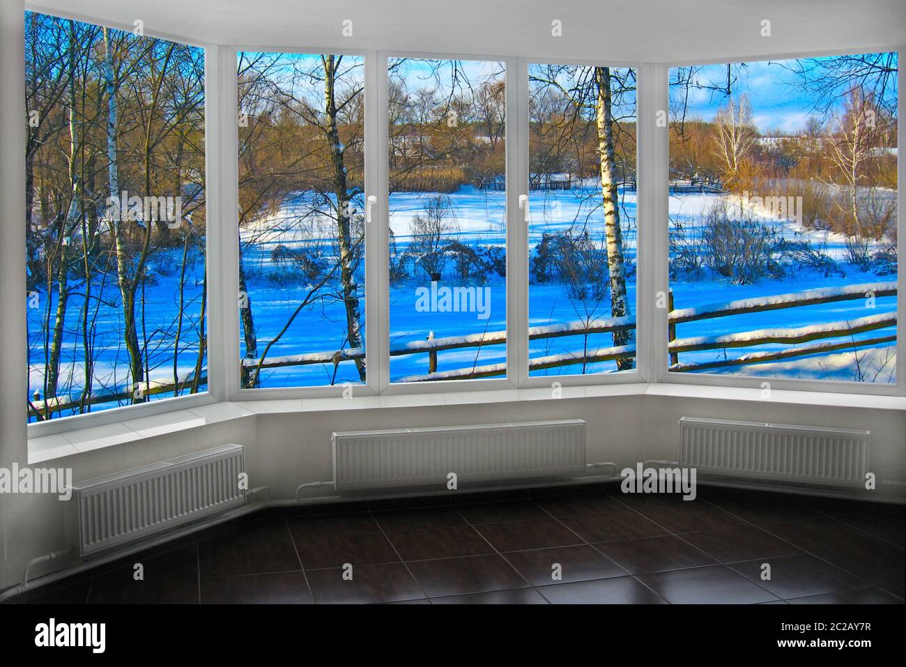 Window behind which snowy winter. Cosy room with window overlooking ...