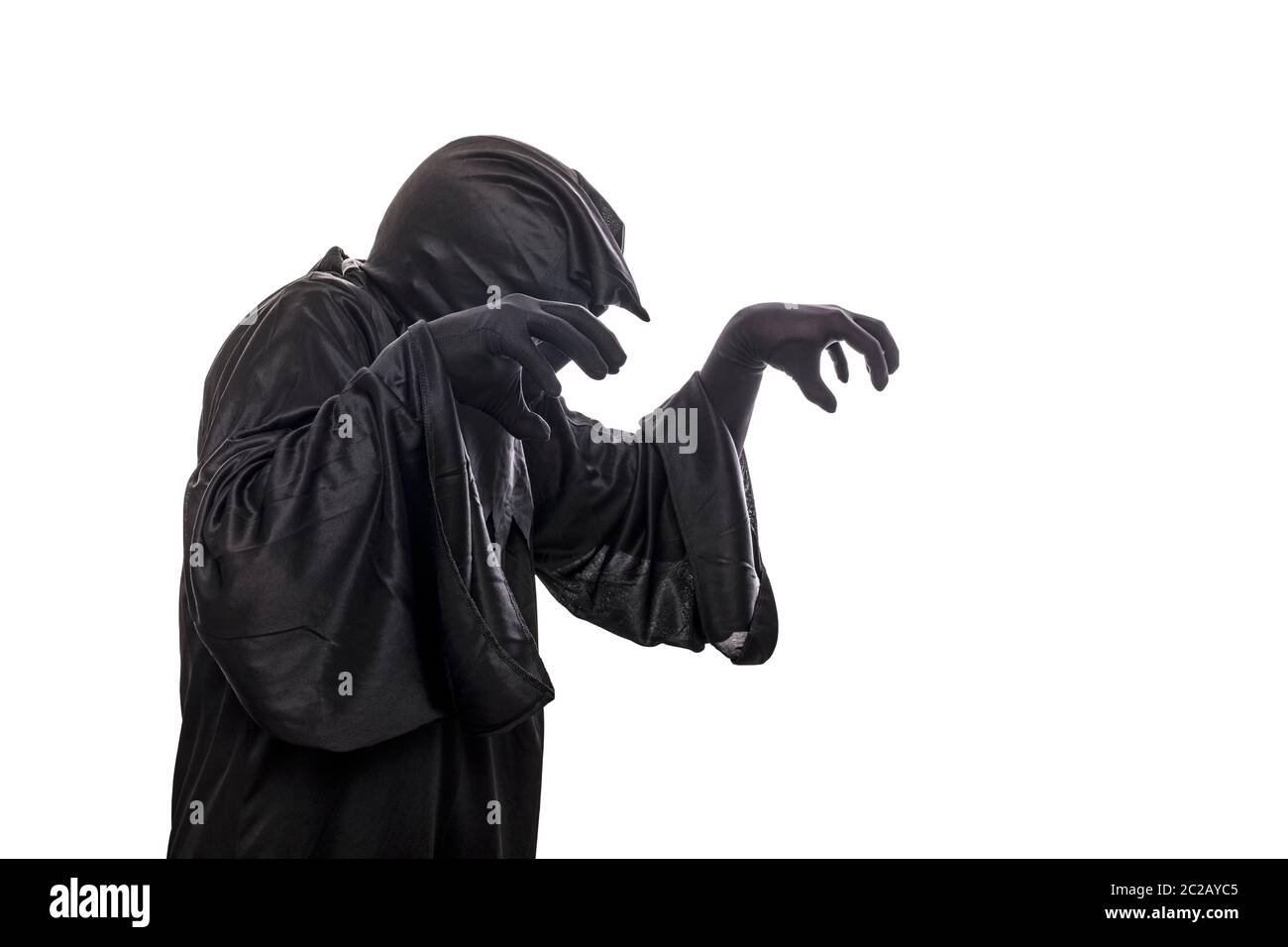 Spooky monster in hooded cloak isolated on white background Stock Photo ...
