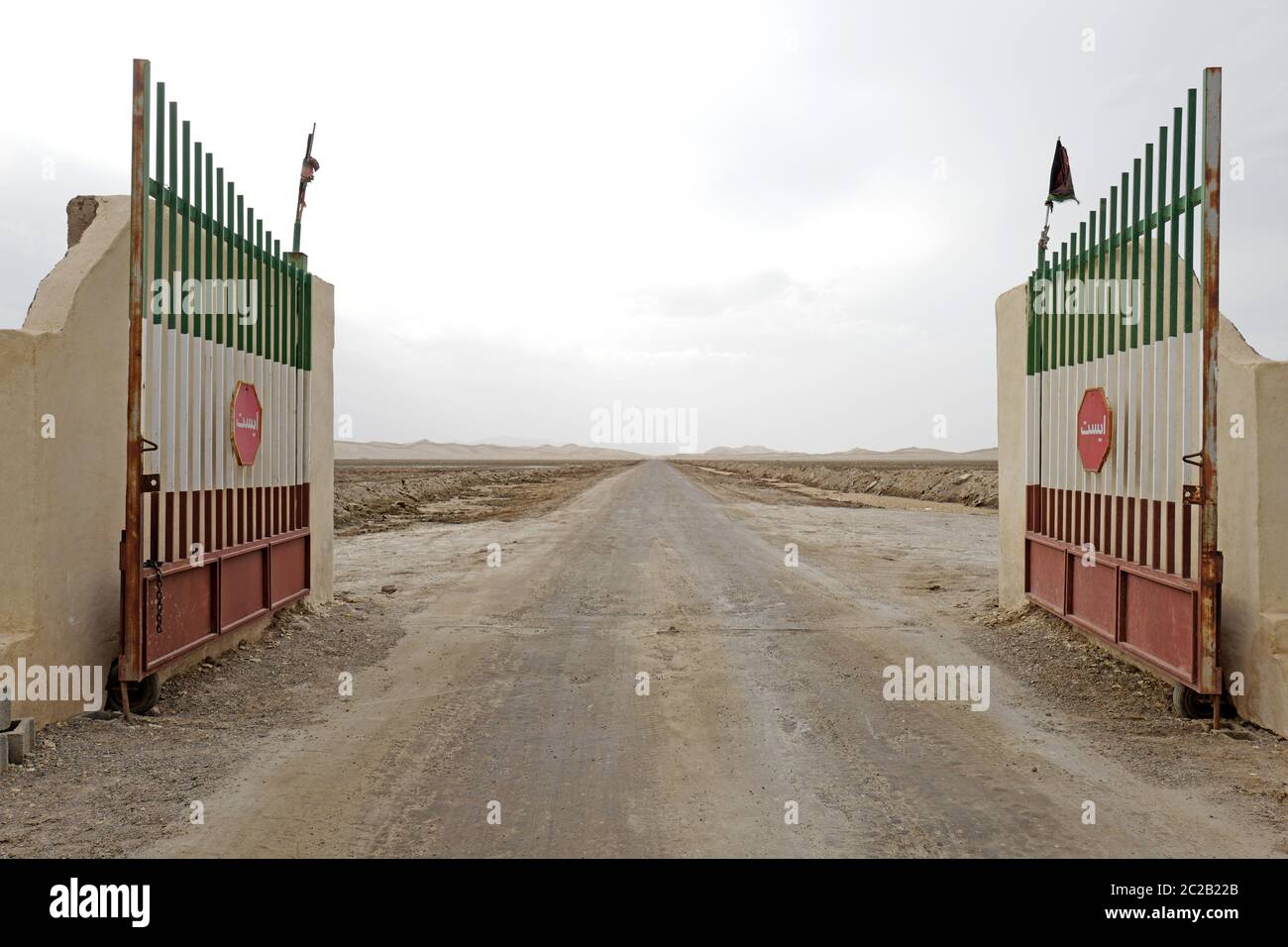 Desert salt lake entrance gate, with Iranian flag colors, in Varzaneh ...