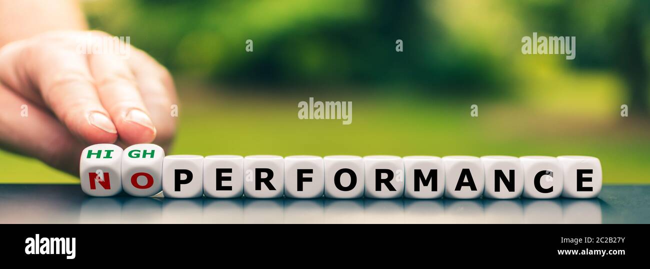 Hand turns dice and changes the expression "no performance" to "high ...
