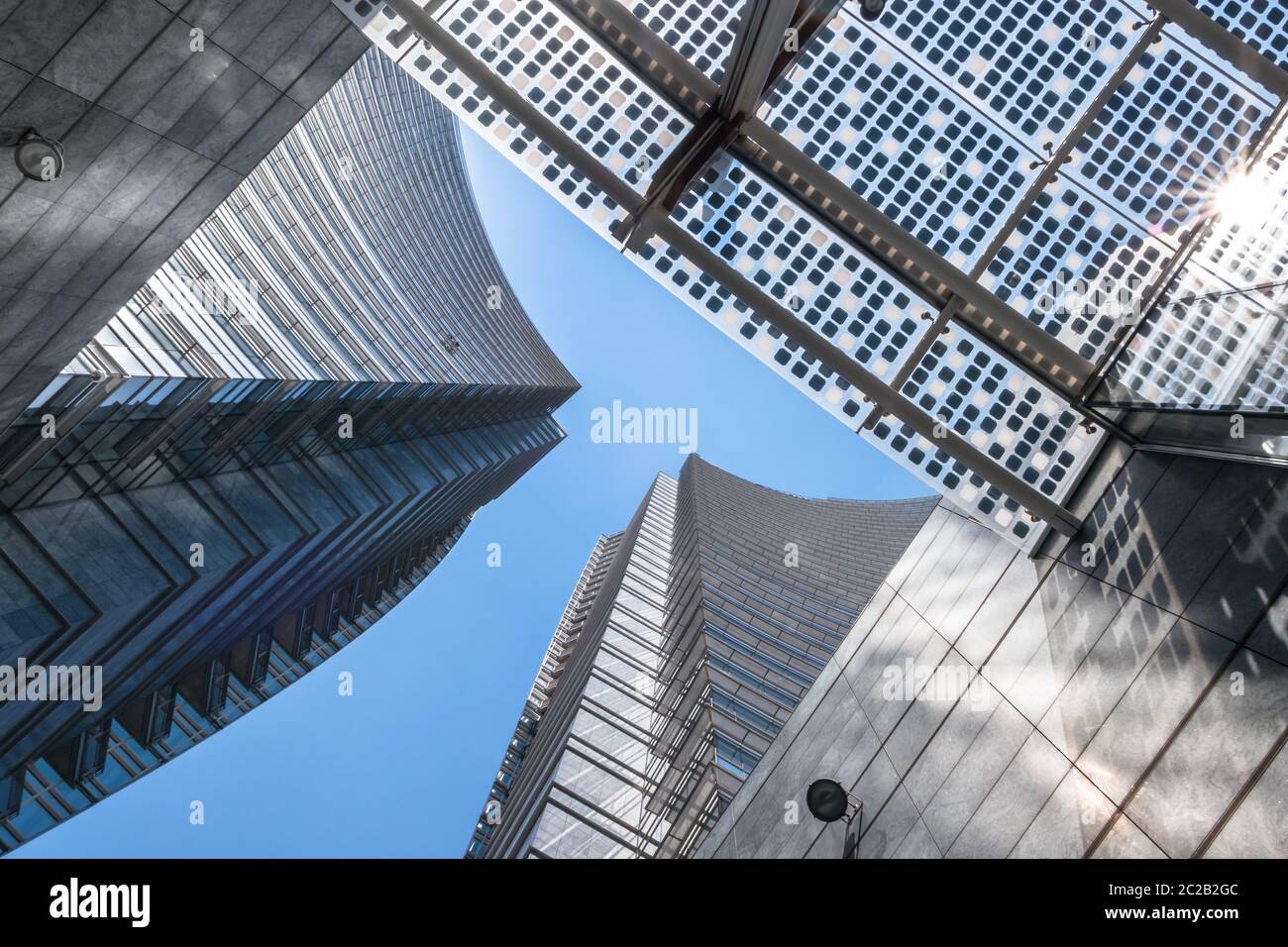 Modern high-rise buildings panoramic view from below. Diminishing ...
