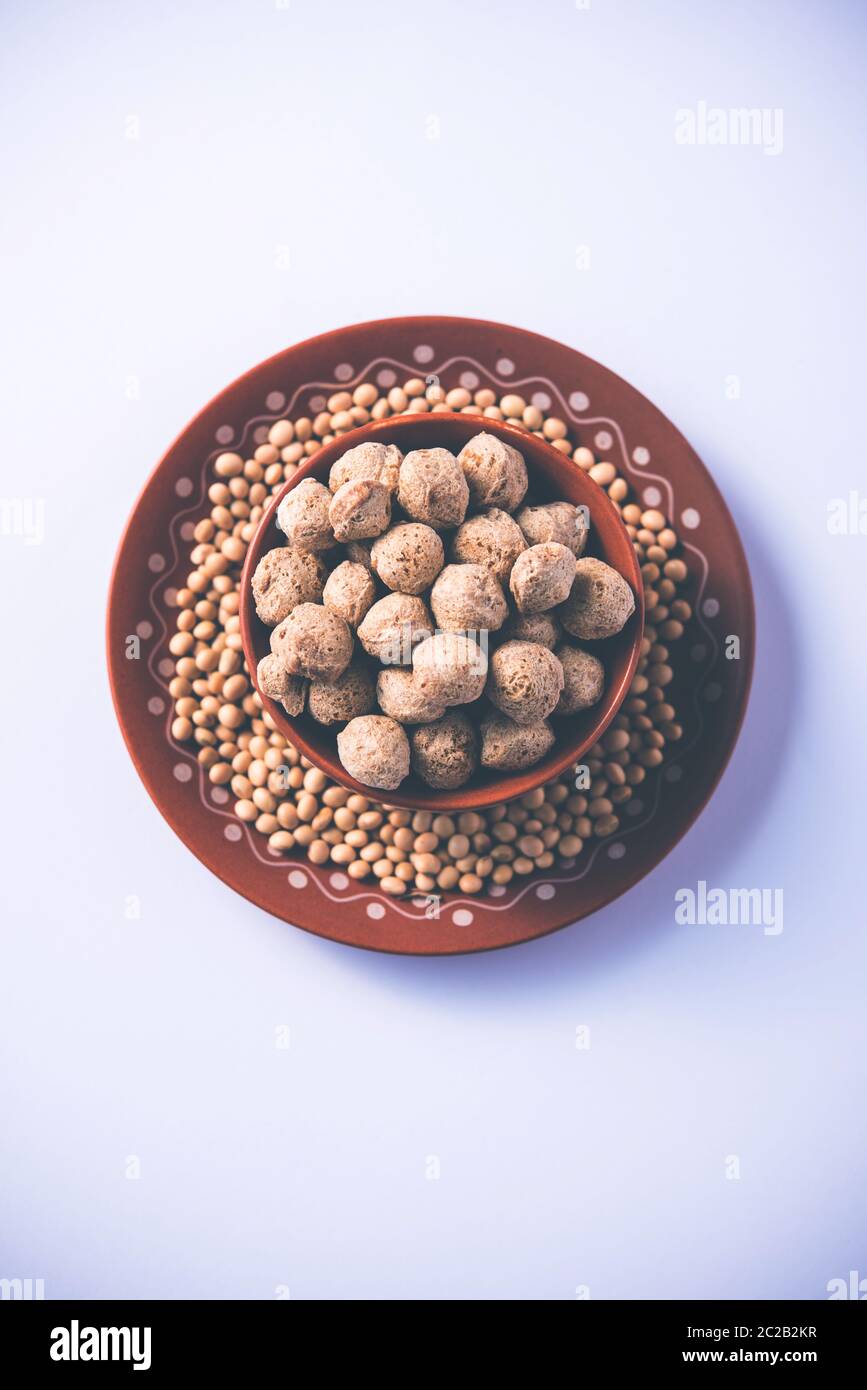 Raw Soya Chunks, Soy Meat for vegans isolated on colourful background ...