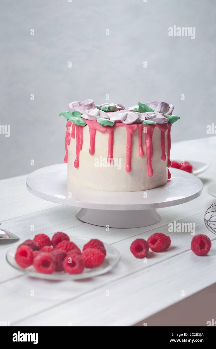 Sweet party decorated cake with raspberry for wedding Stock Photo - Alamy