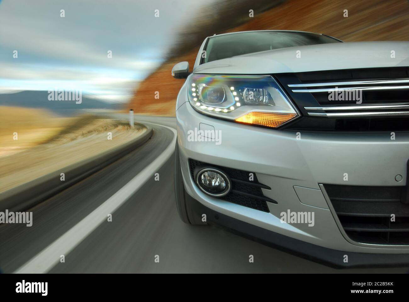 Dynamic driving an SUV in a curve Stock Photo - Alamy