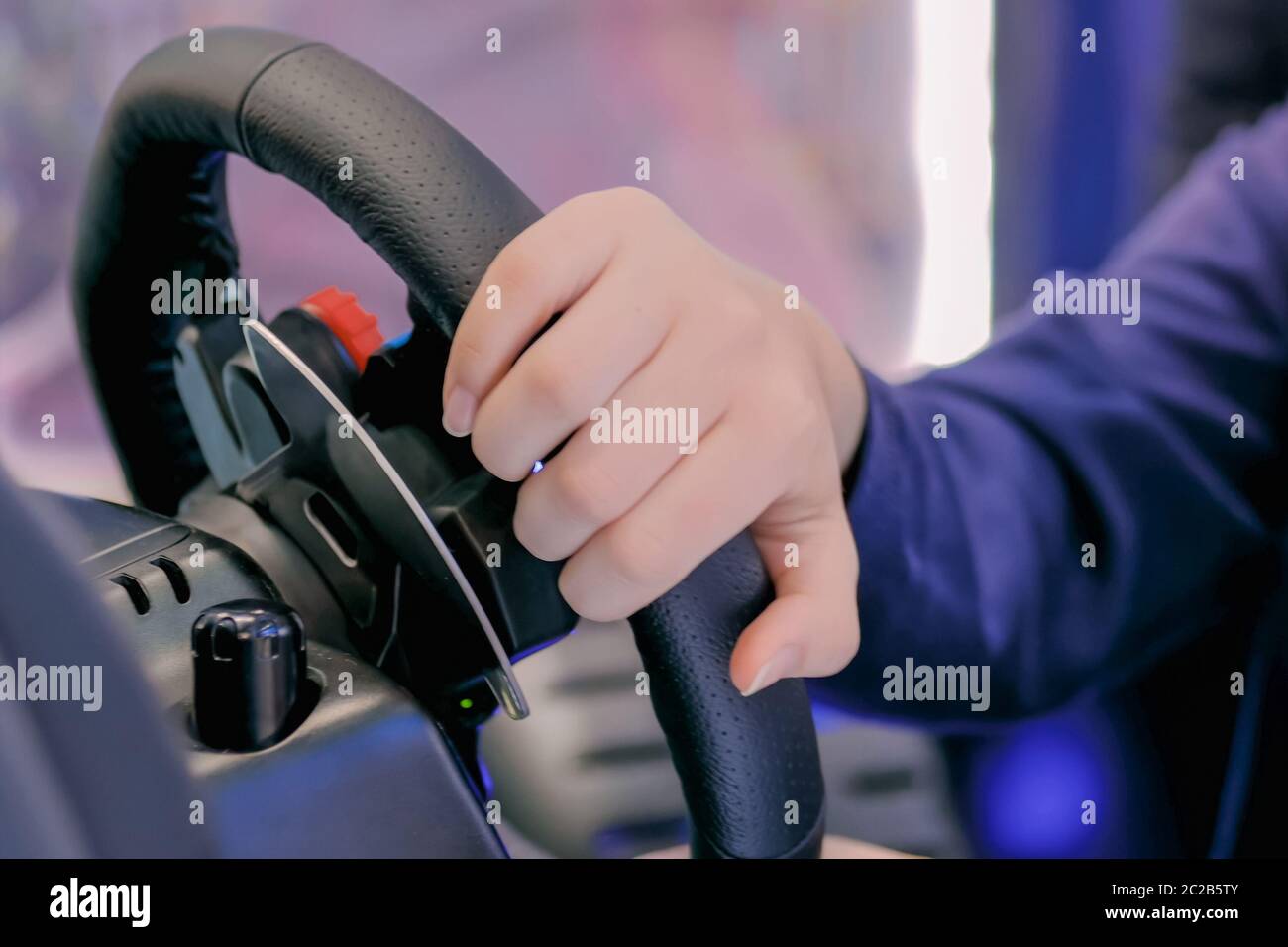 Man gamer hand using black gaming steering wheel joystick and playing ...