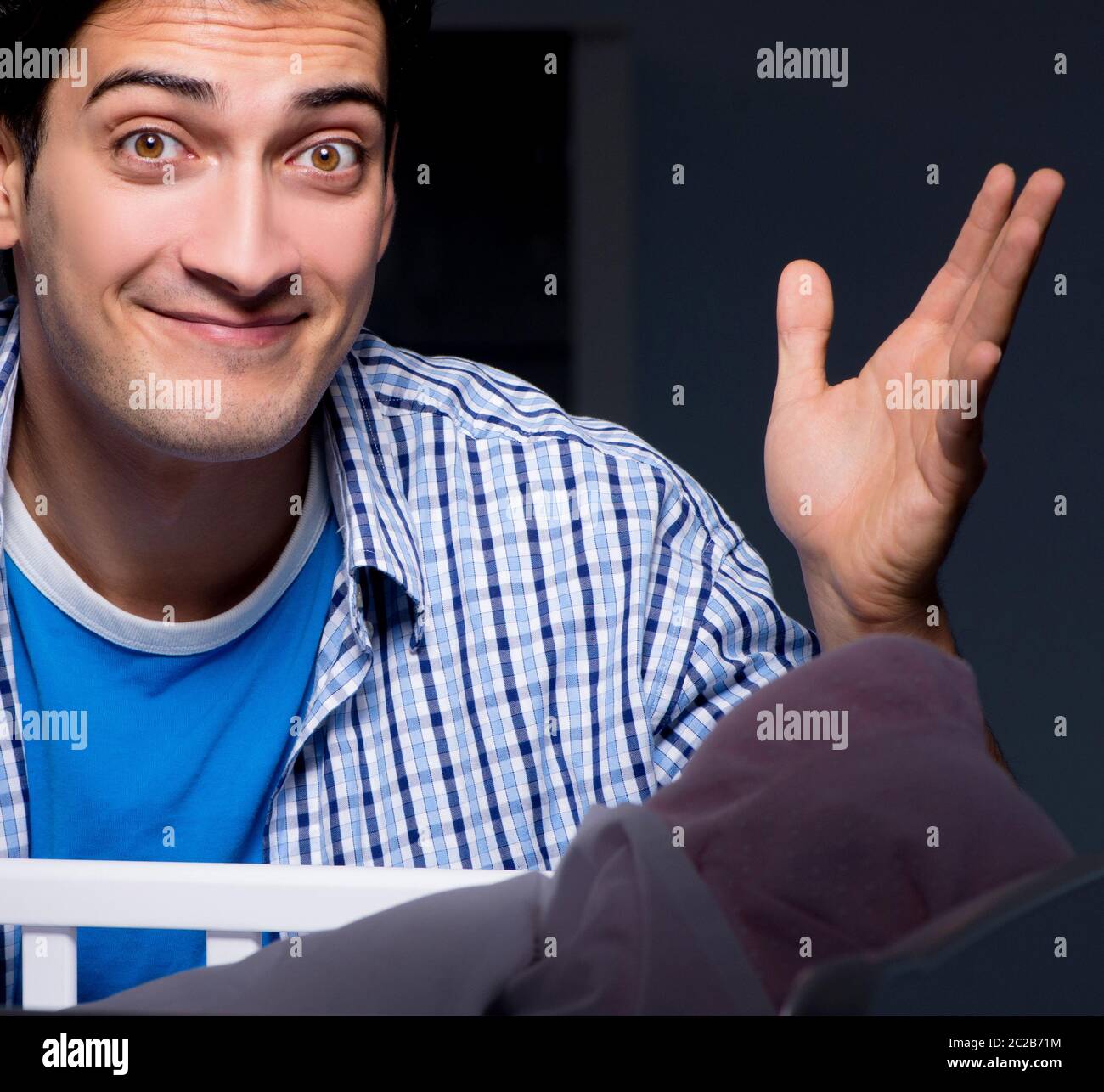 Happy dad looking after newborn baby at night Stock Photo - Alamy