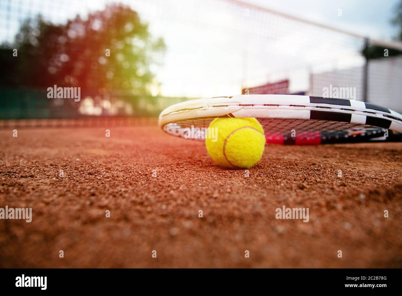 tennis racket. Close up view of tennis racket and balls on the tennis ...