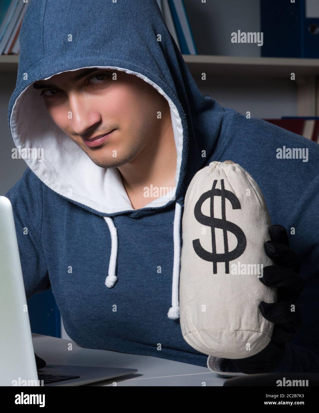 Young hacker hacking into computer at night Stock Photo - Alamy