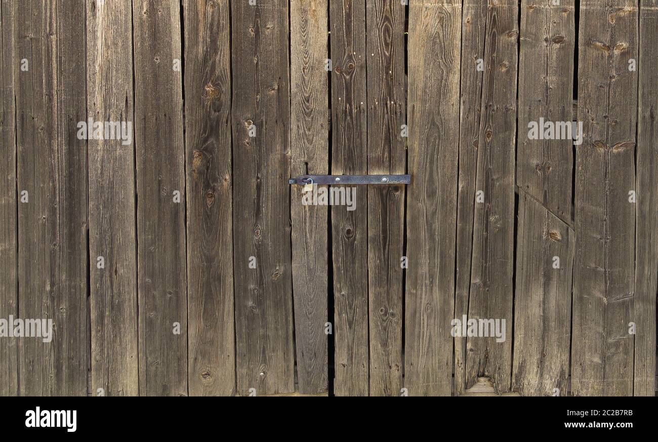 Old, worn wooden gate. Background image Stock Photo - Alamy
