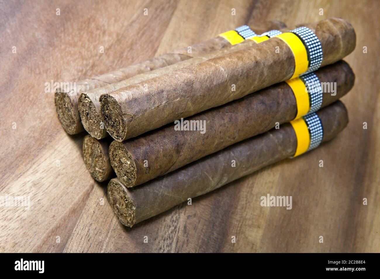 rolled cigars from a tobacco leaf on a wooden background, Small depth ...