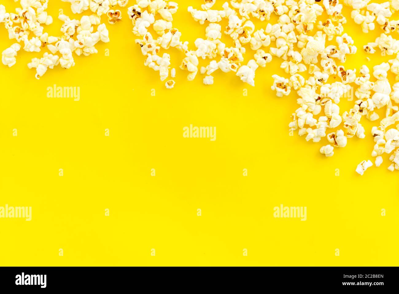 Popcorn on yellow table top-down frame copy space Stock Photo - Alamy
