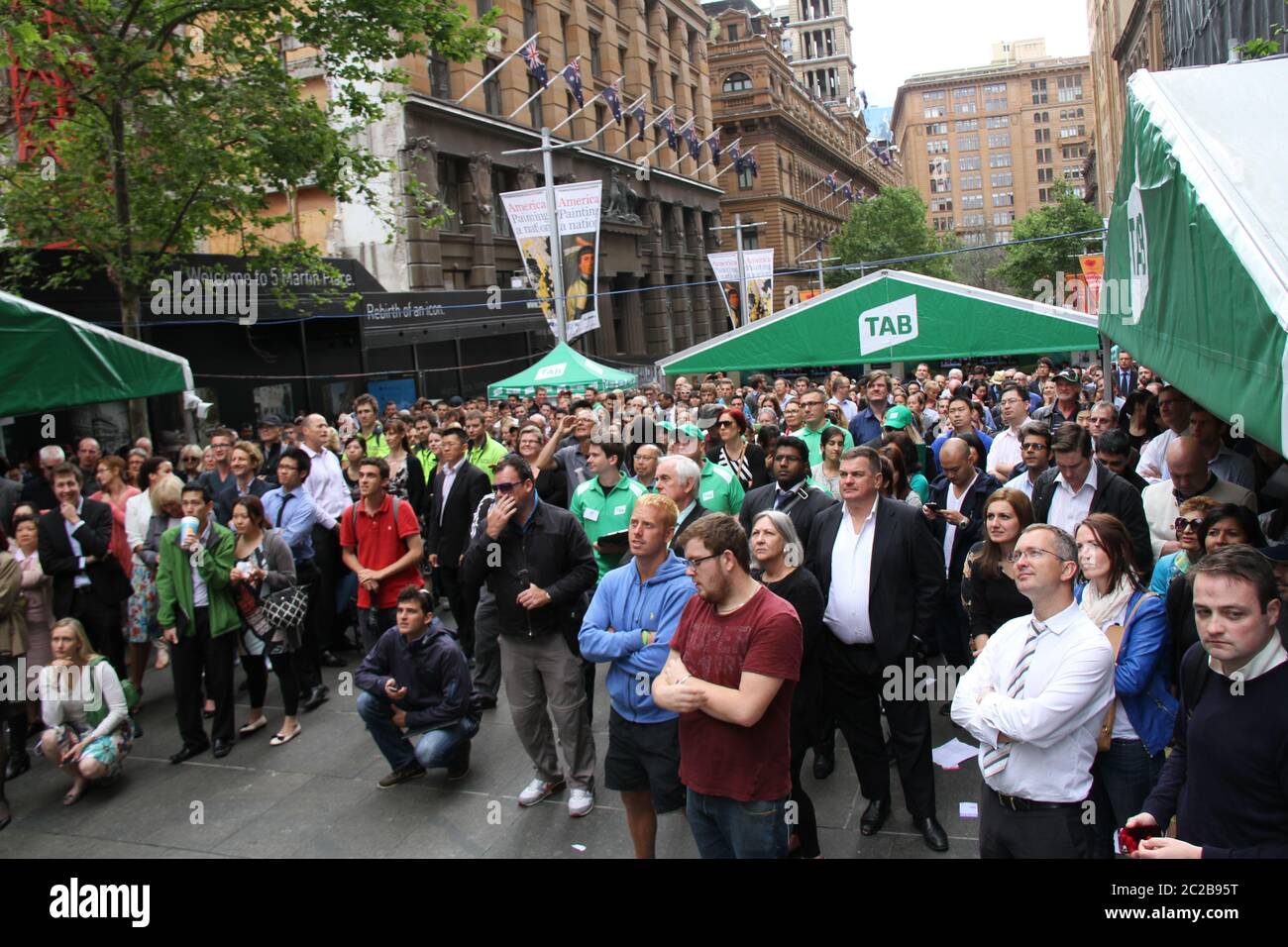 People gather in Martin Place, Sydney to place bets and watch the ...