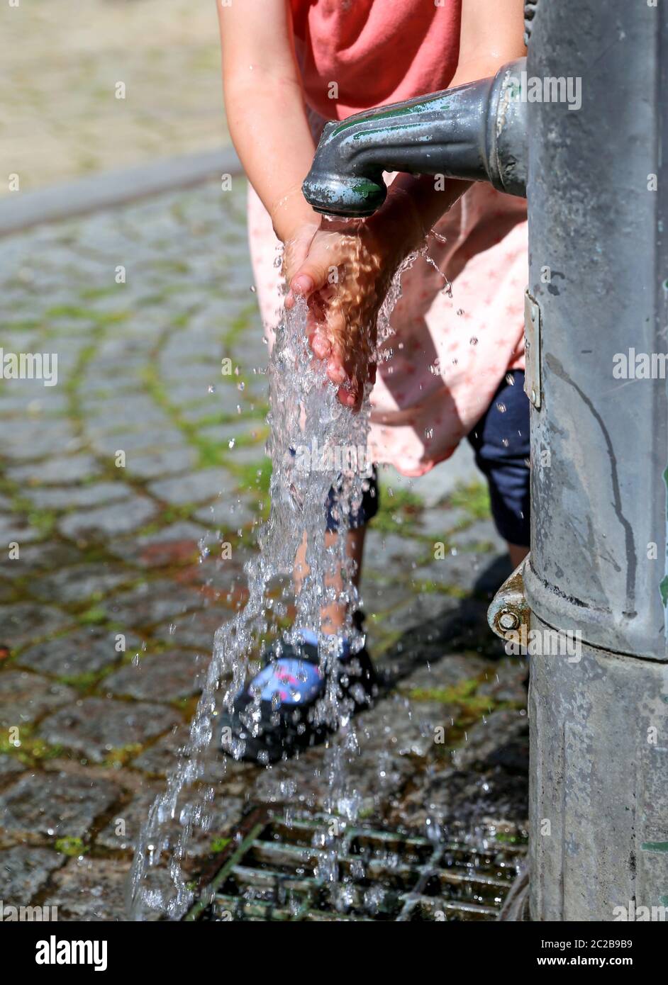 One of the drinking water wells in the city center of MÃ¼llheim Stock ...