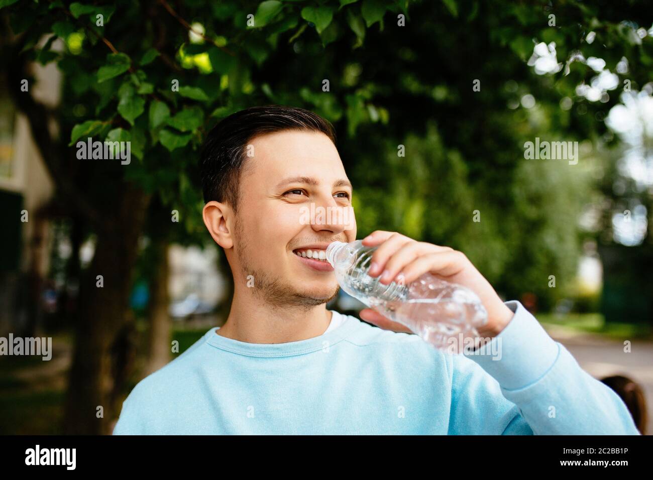 Guy drinks water from bottle hi-res stock photography and images - Alamy