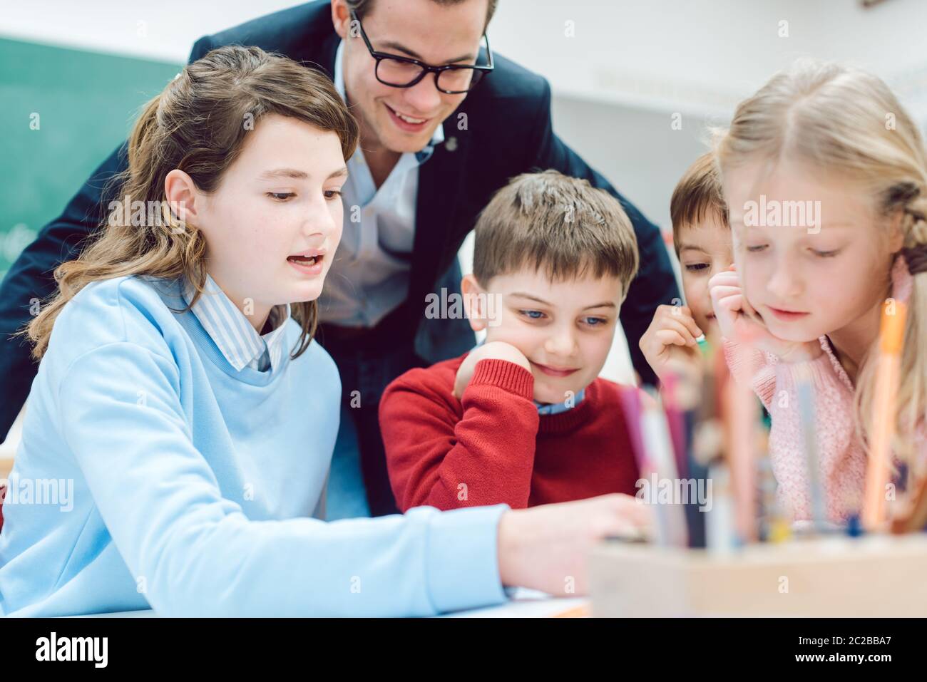 Team session in school class with all students working together as a ...