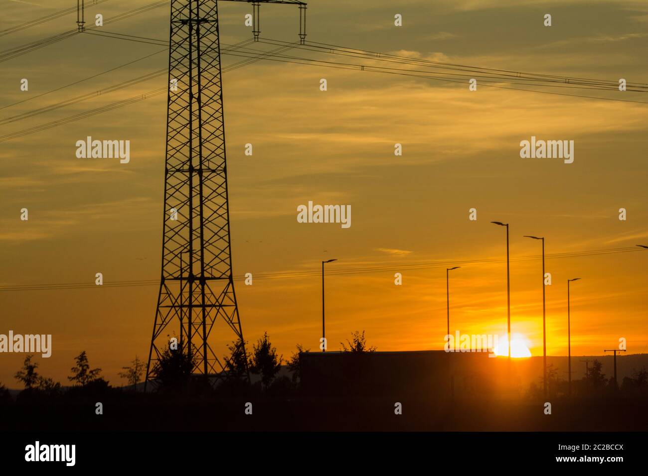 electric grid at sunset Stock Photo - Alamy
