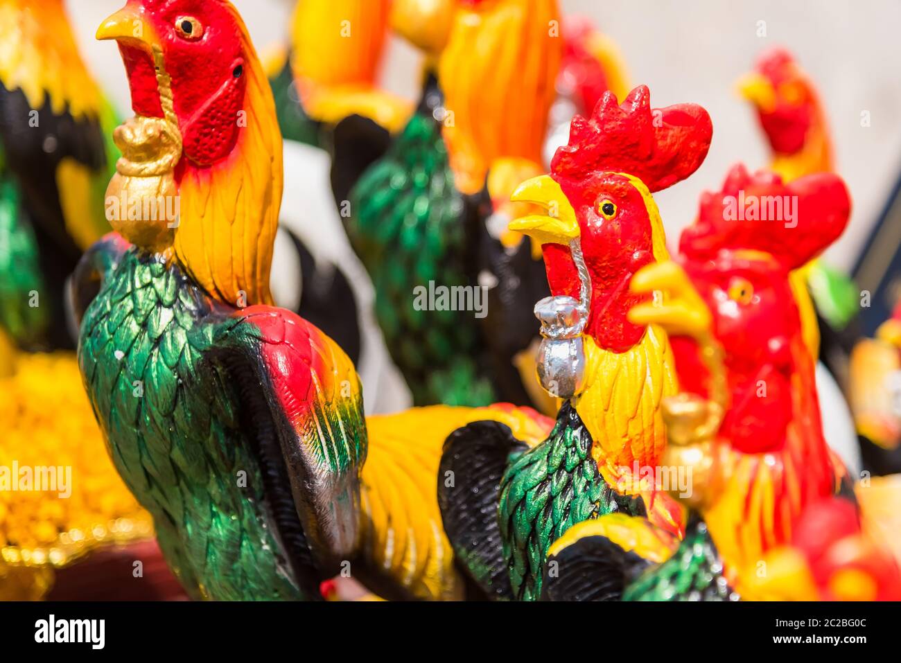Chicken statue for worship at the temple Stock Photo - Alamy