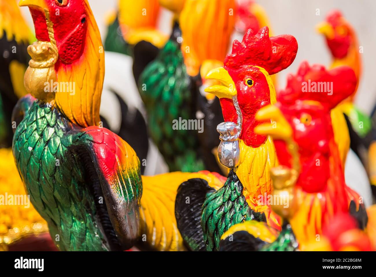 Chicken statue for worship at the temple Stock Photo - Alamy