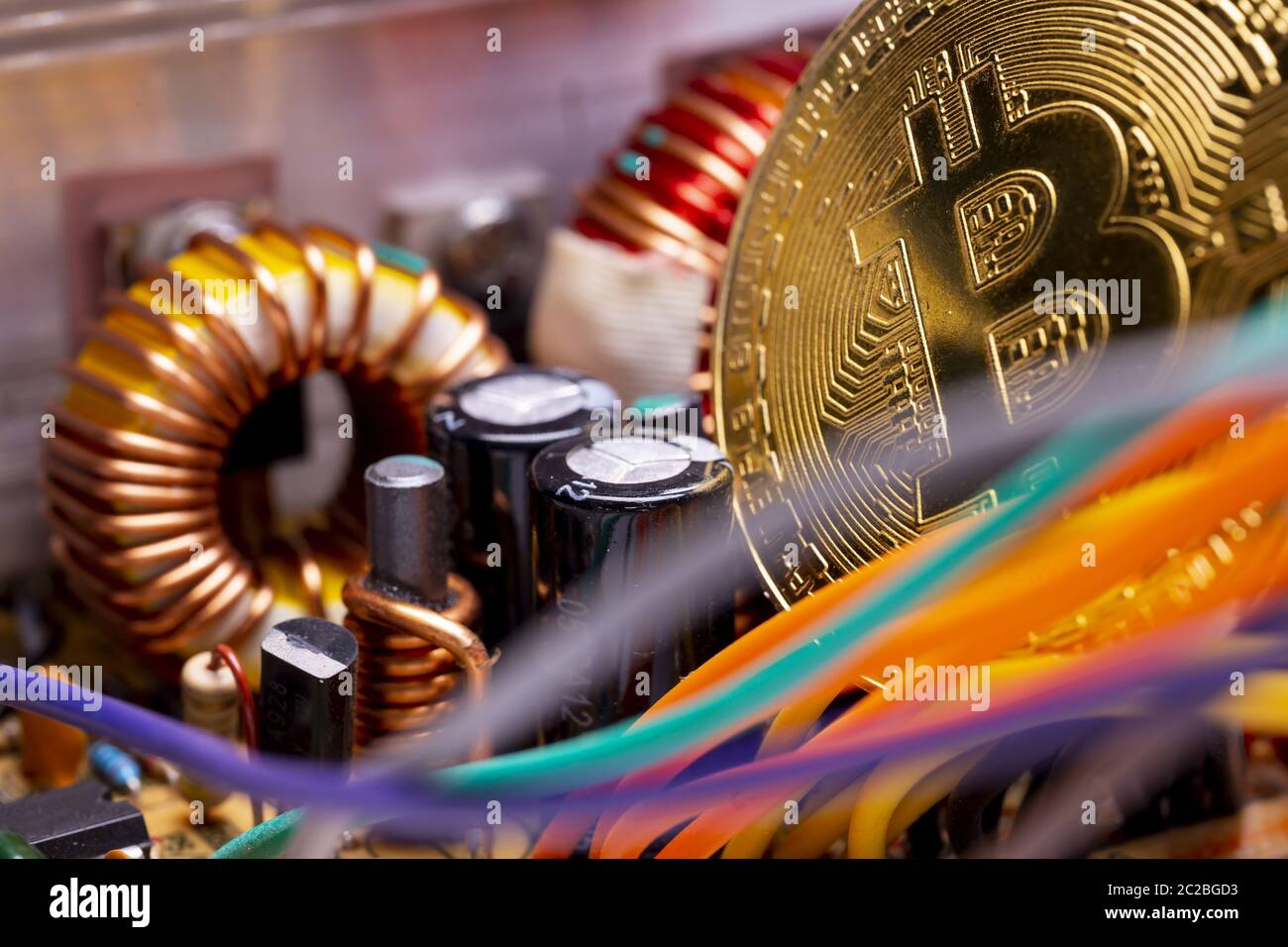 Bitcoin coin, colorful cables and printed circuit board PCB Stock Photo ...