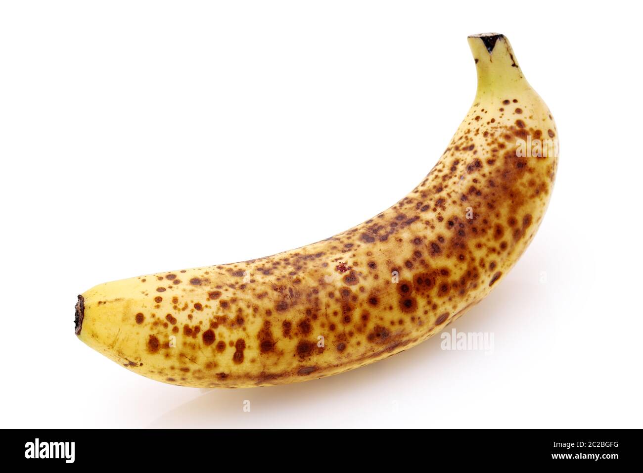 Close up of an over-ripe banana isolated on white background Stock ...