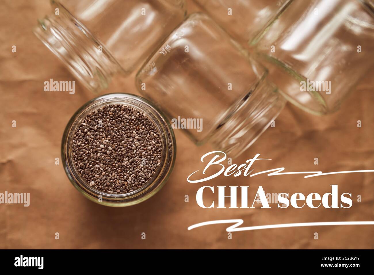 Glass jars. In one of which are the seeds of Chia. With text ...