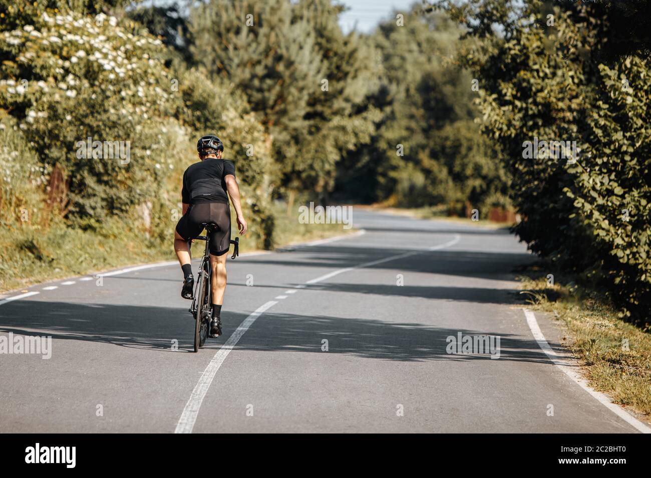 Back view of male athlete in sport clothing and protective helmet ...