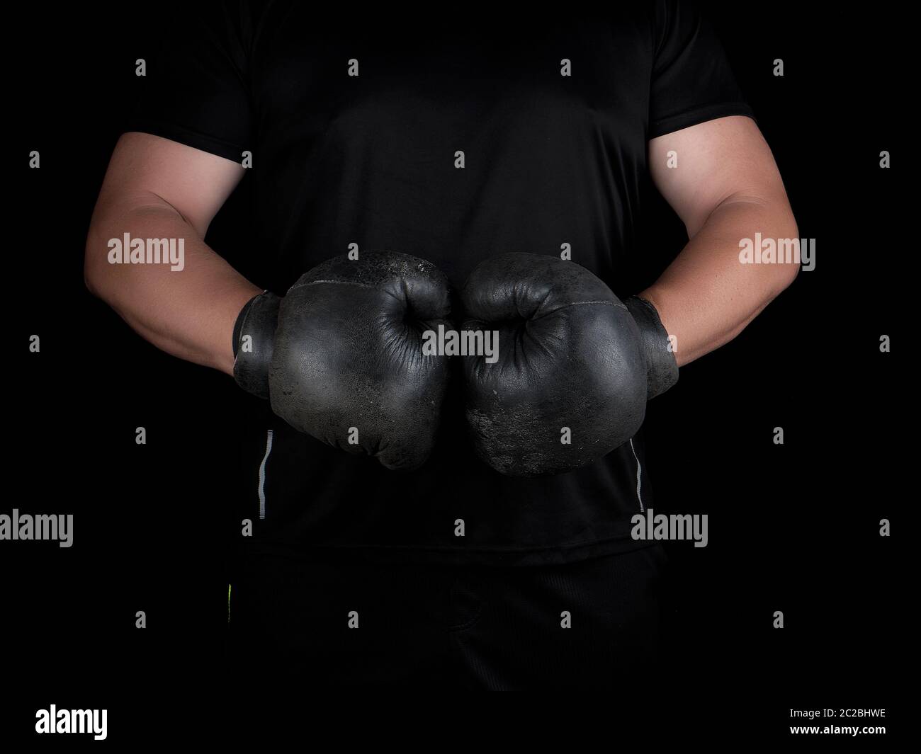 Hand wearing black glove holding hi-res stock photography and images ...