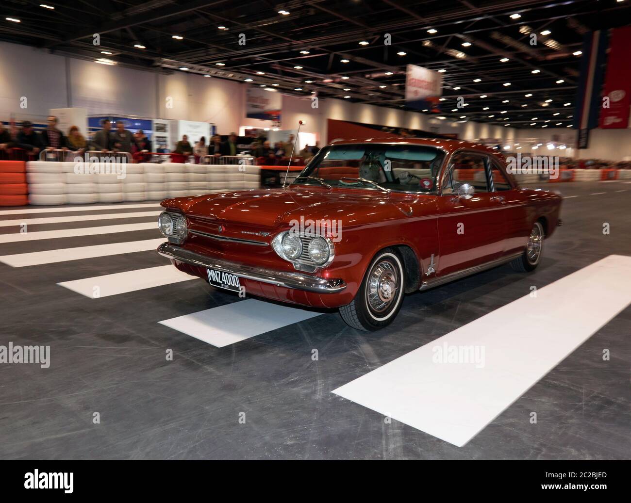 A Red, 1963, Chevrolet Corvair Monza Spyder, driving down the Grand ...