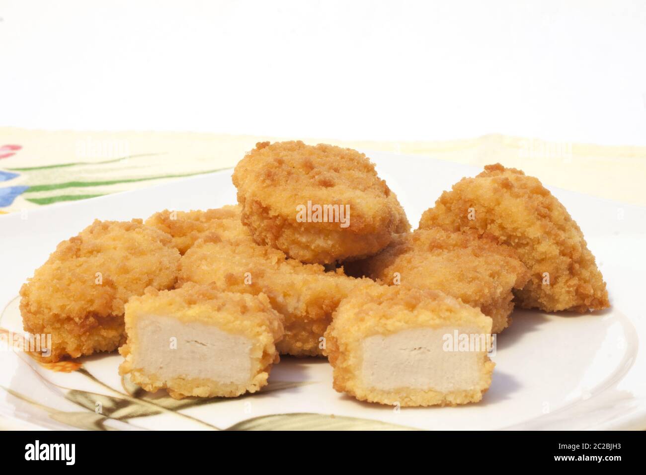 breaded chicken nuggets with packaging Stock Photo - Alamy