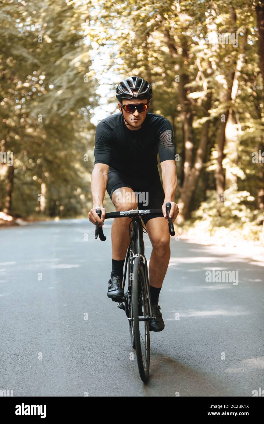 Front view of bearded man with athletic body shape dressed in sport ...