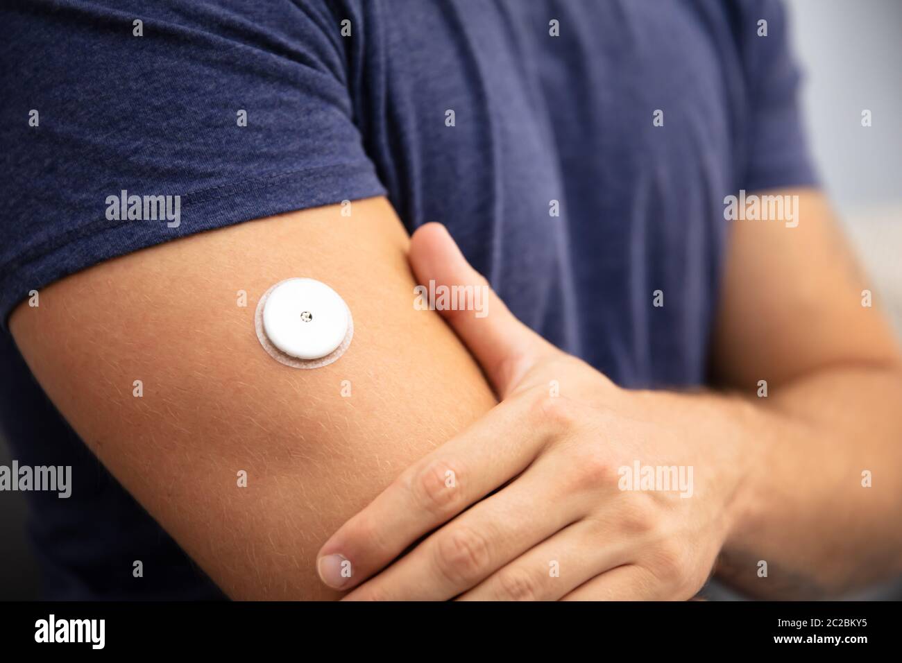 Close-up Of A Man Testing Glucose Level With A Continuous Glucose ...