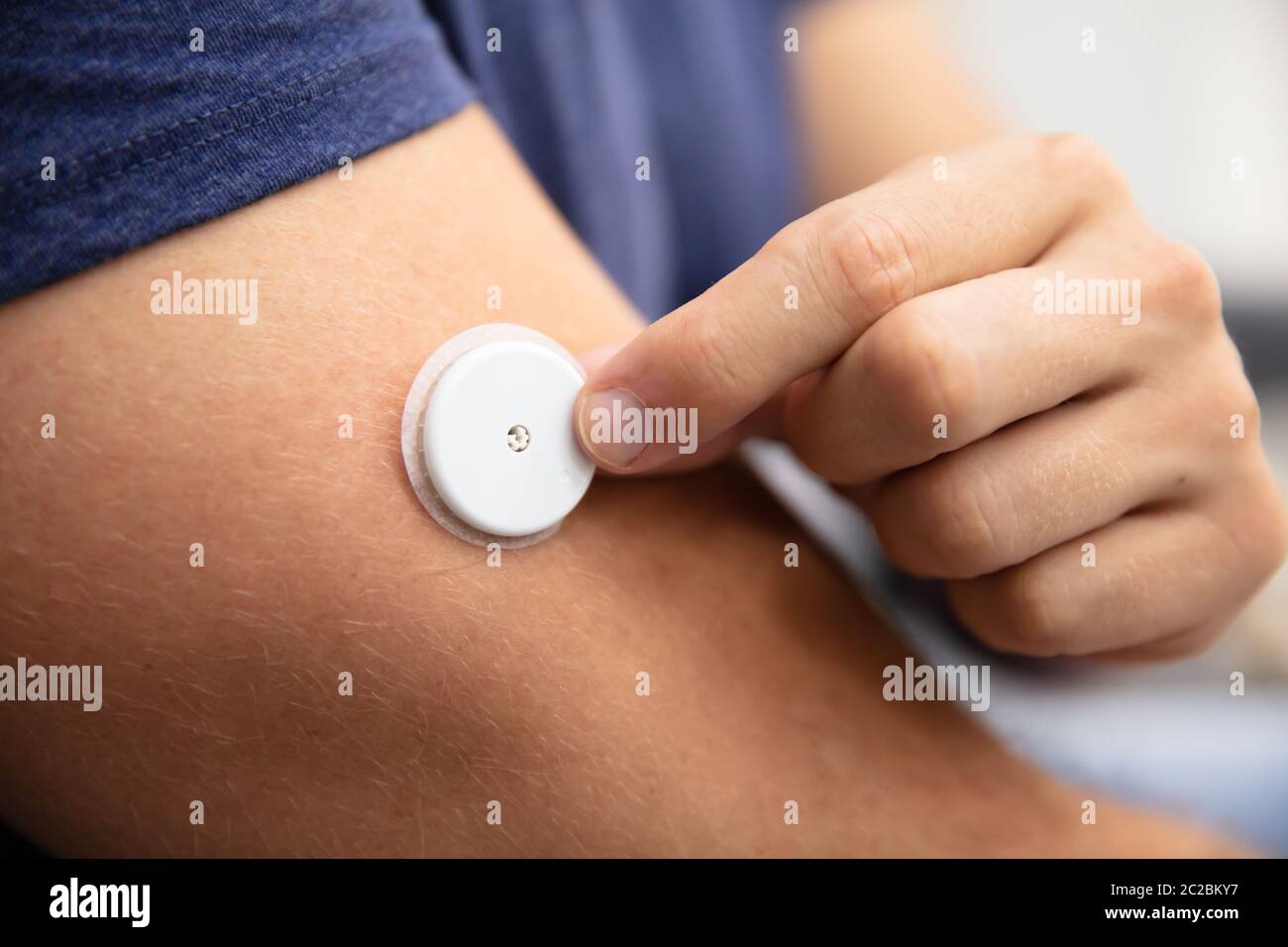 Close-up Of A Man Testing Glucose Level With A Continuous Glucose ...