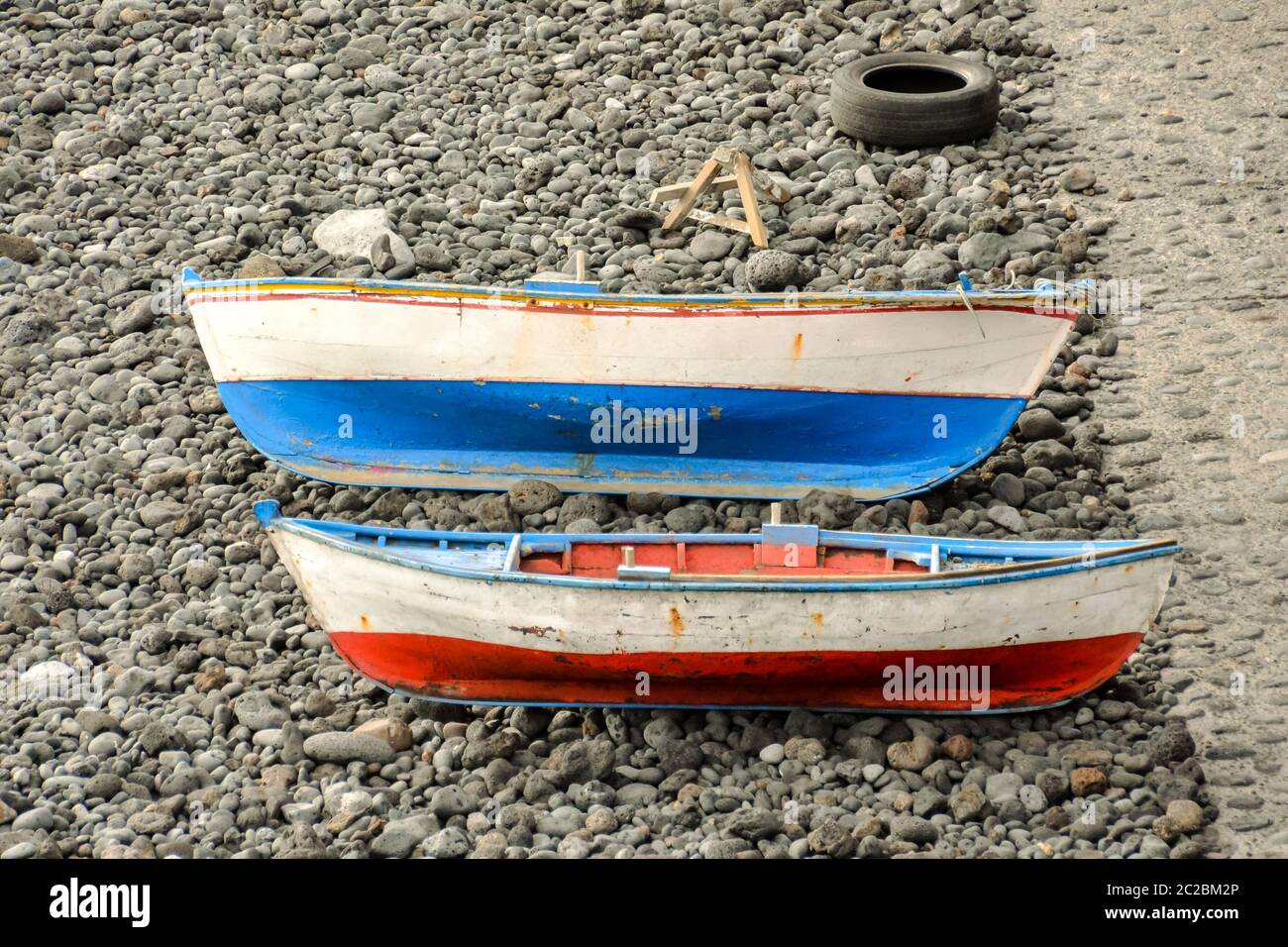 Photo Picture of a Colored Boat Near the Ocean Coast Stock Photo - Alamy